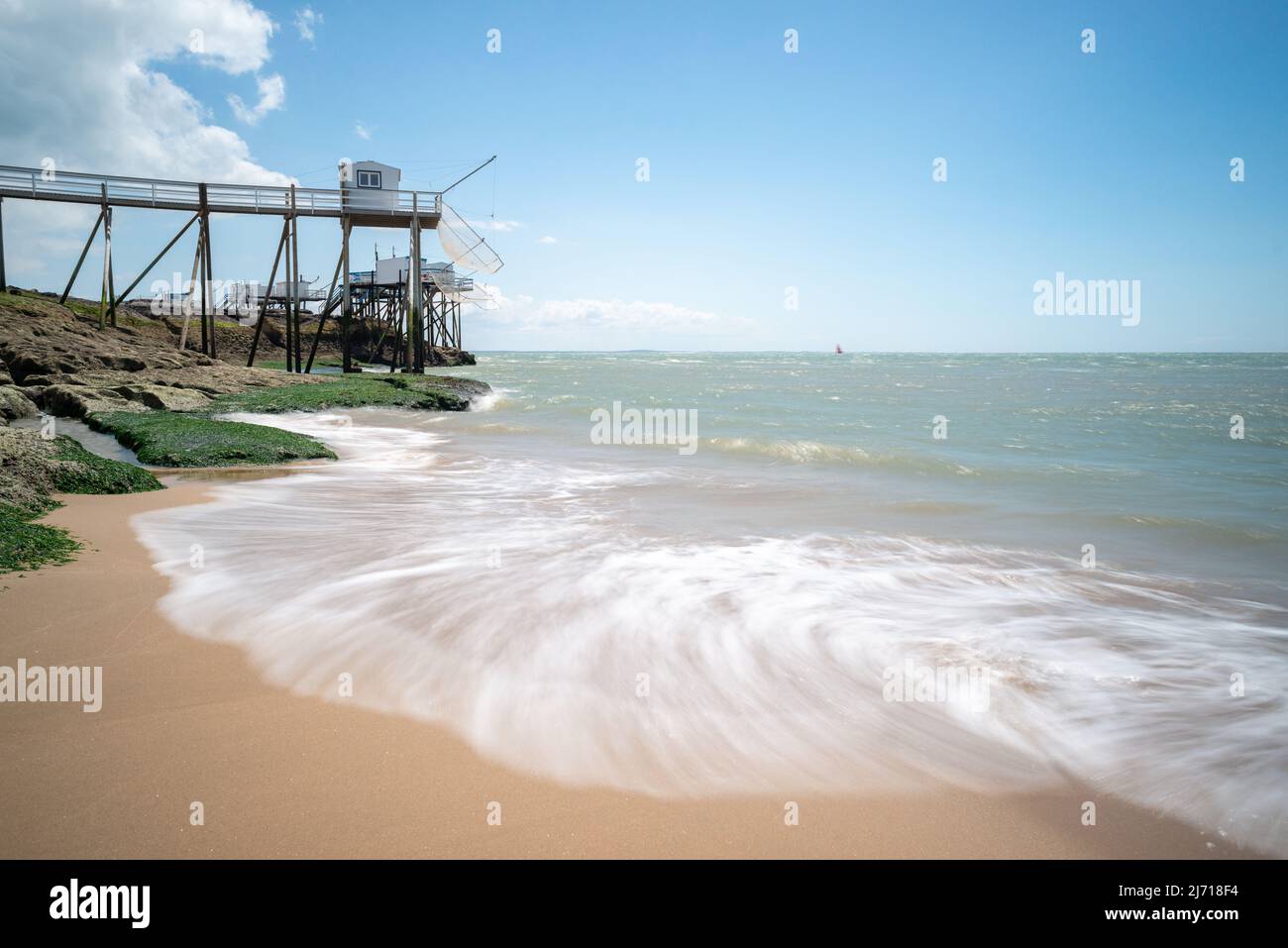 Ocean waves swashing on sandy beach at Charente Maritime on western ...