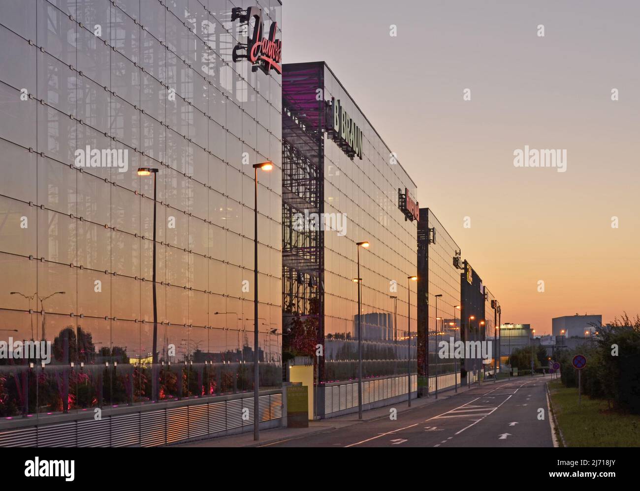 Modern glass office buildings at dusk, companies headquarters in Chodov ...