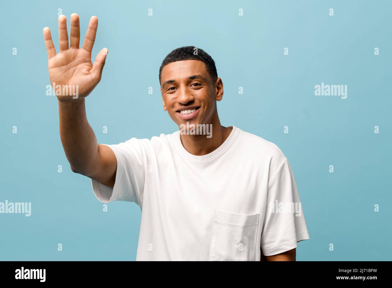 African man waving welcoming on hi-res stock photography and images - Alamy