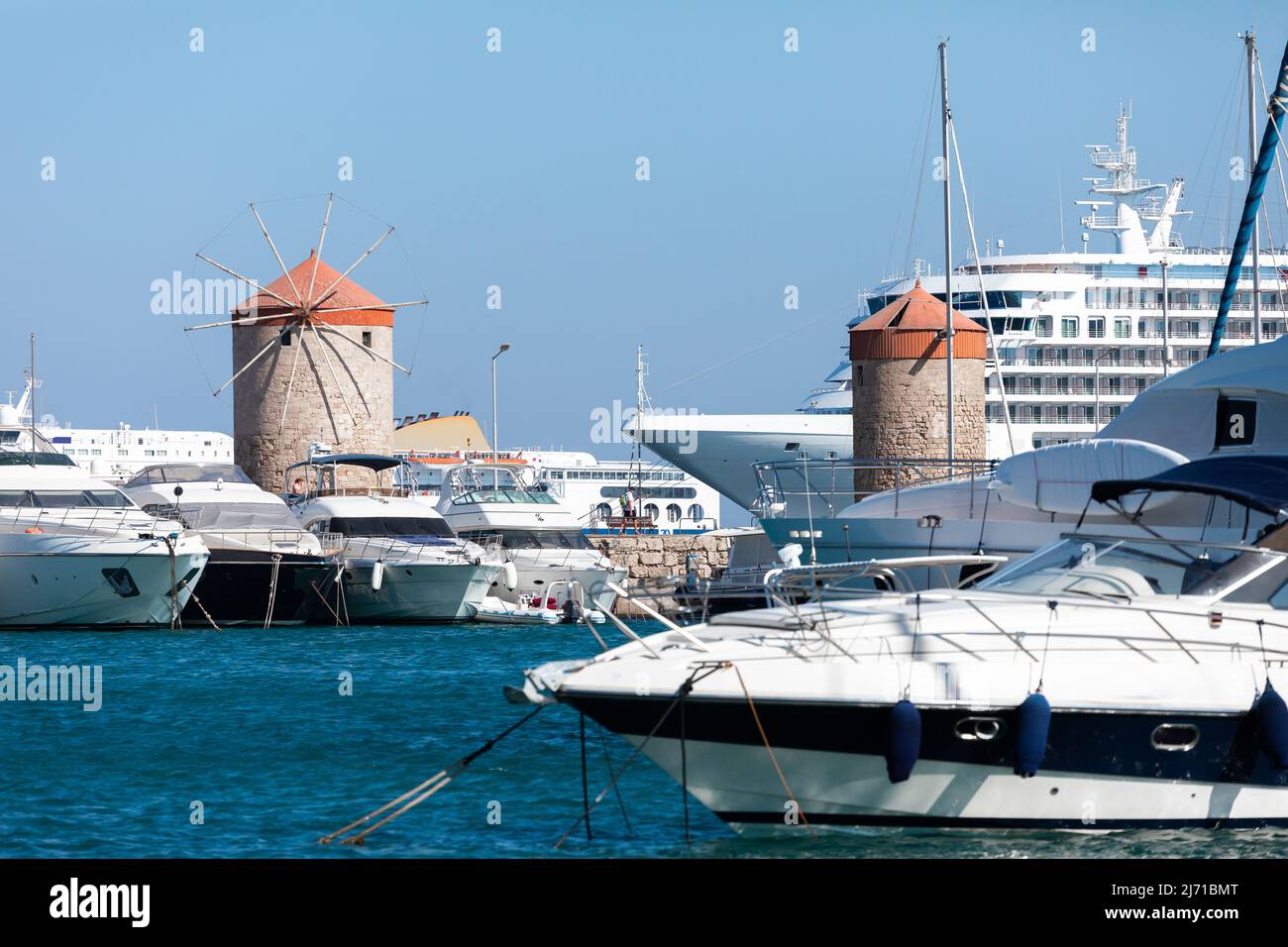 Windmills in the Mandraki port of Rhodes, Greece Stock Photo - Alamy