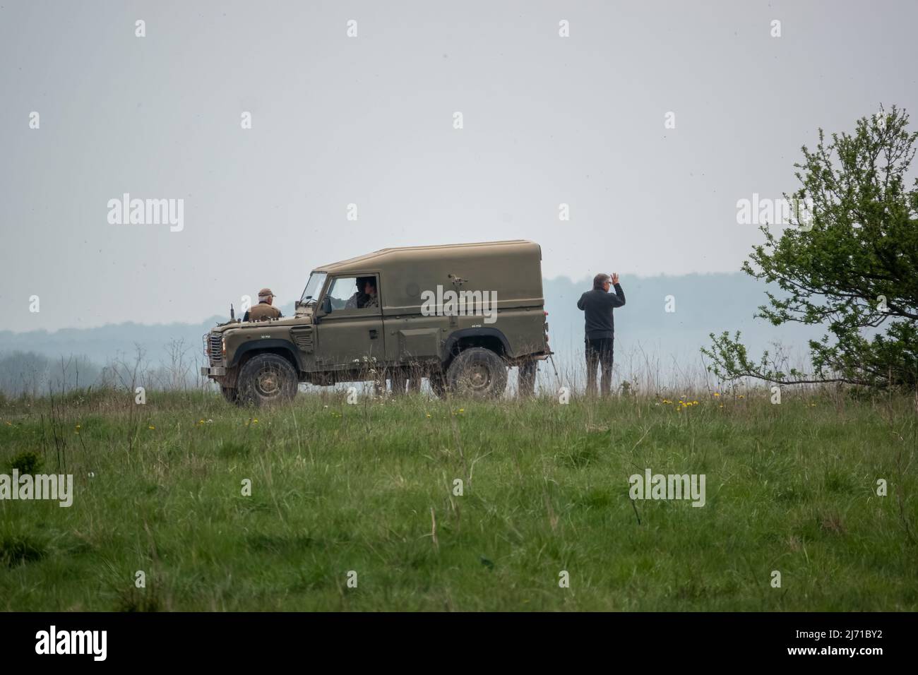 British army Land Rover Defender Wolf medium utility vehicle driving ...