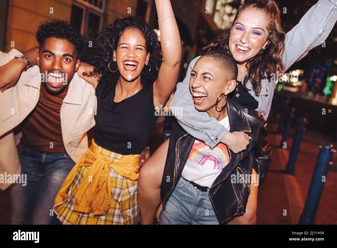 Group of friends laughing and living their best lives in the city. Happy young people having fun ...