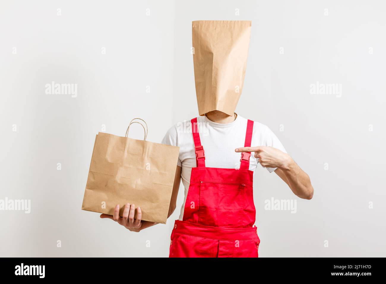 man with food delivery package with packages on his head Stock Photo ...