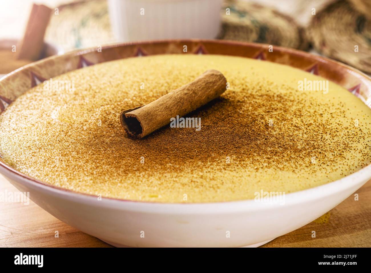 Bowl with corn jam called Curau, jimbelê or hominy, decorated with ...