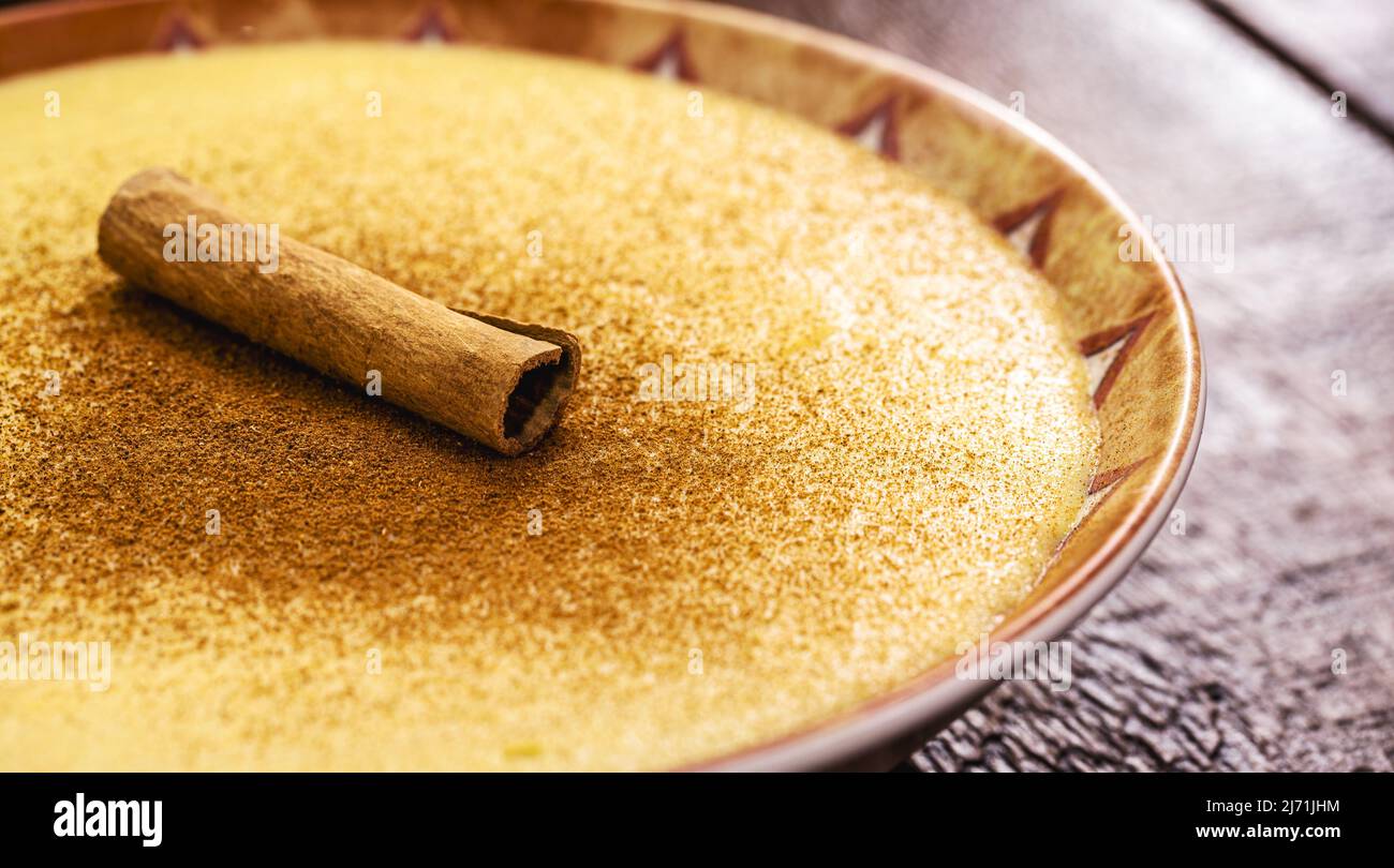 Bowl with corn jam called Curau, jimbelê or hominy, decorated with ...