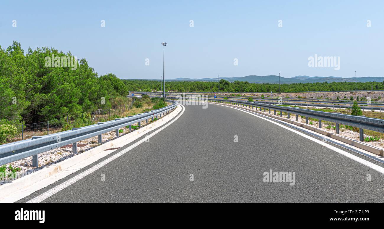 Asphalt road surrounded forest car hi-res stock photography and images ...
