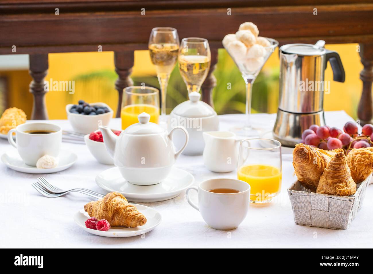 Luxury brunch on the hotel terrace, coffee maker, teapot, cups ...