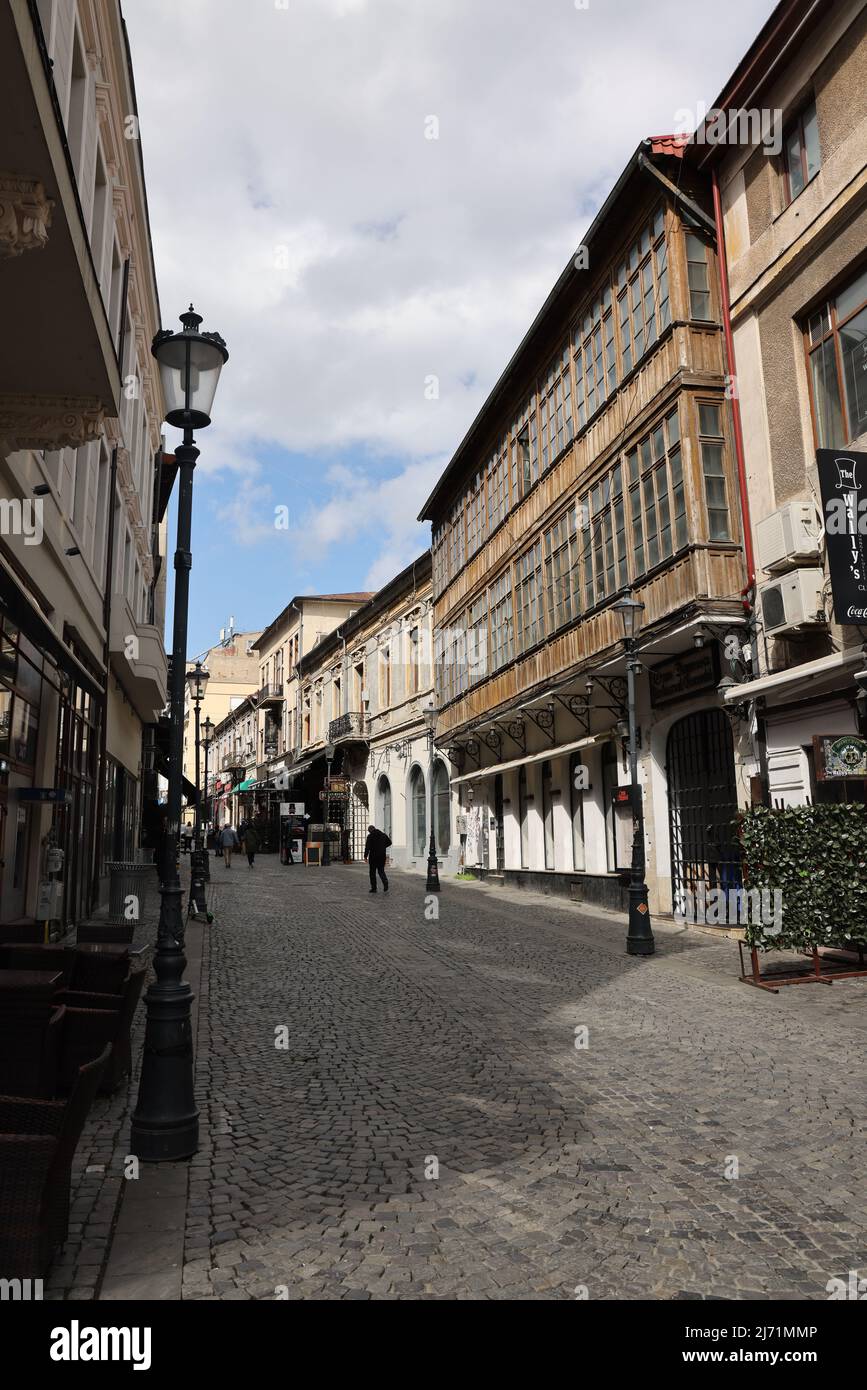 Historic wooden building in the Old Town of Bucharest, Romania; street ...