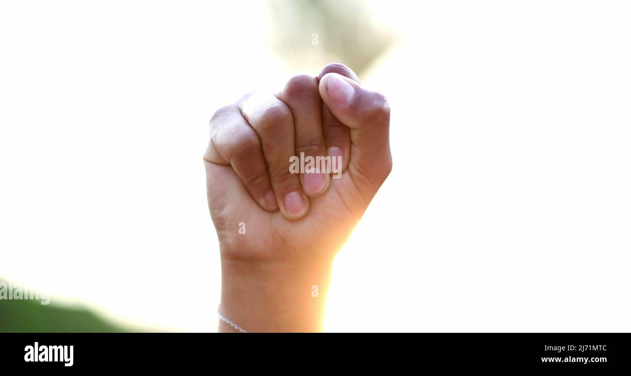 Black hand raised fist in air in political protest, close-up clench ...