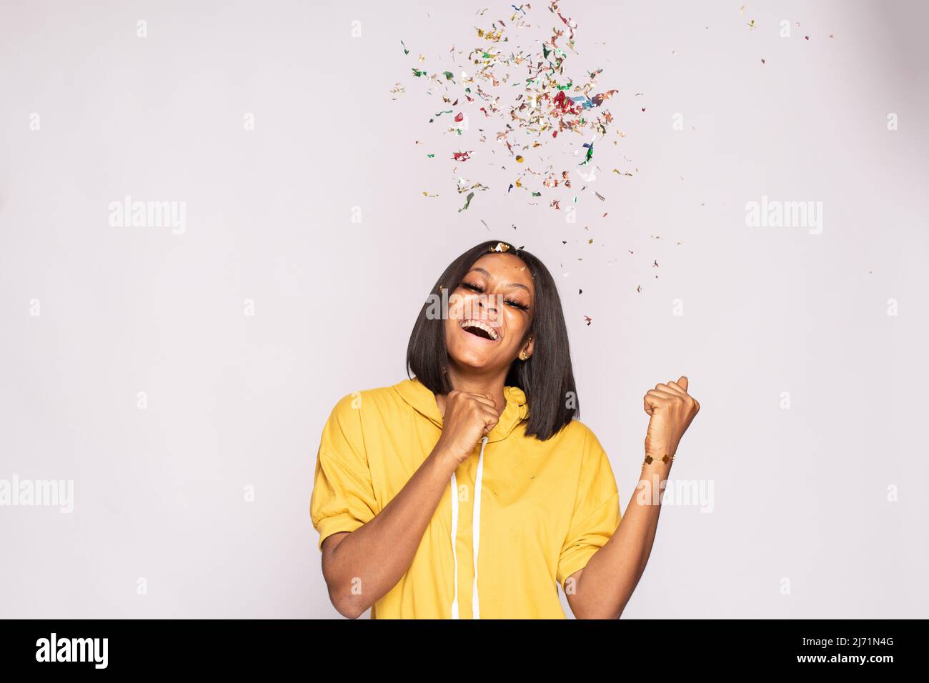 Woman win confetti hi-res stock photography and images - Alamy
