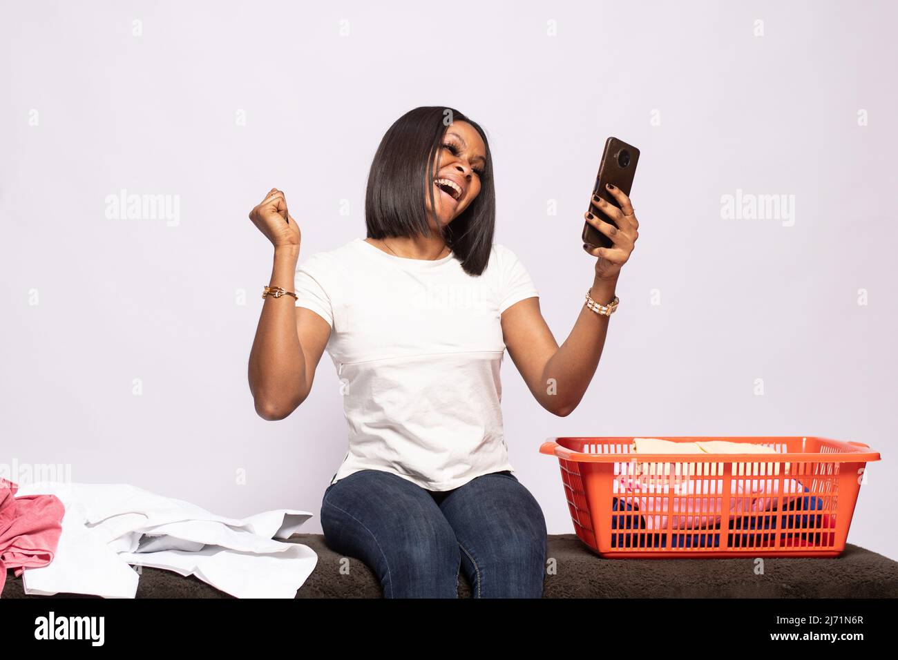 Lady doing laundry hi-res stock photography and images - Alamy