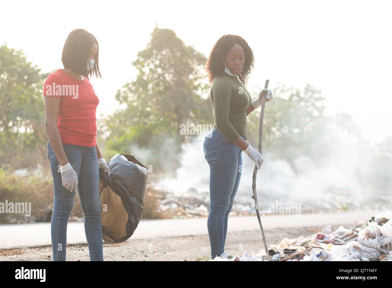 african women cleaning a refuse dump together Stock Photo - Alamy