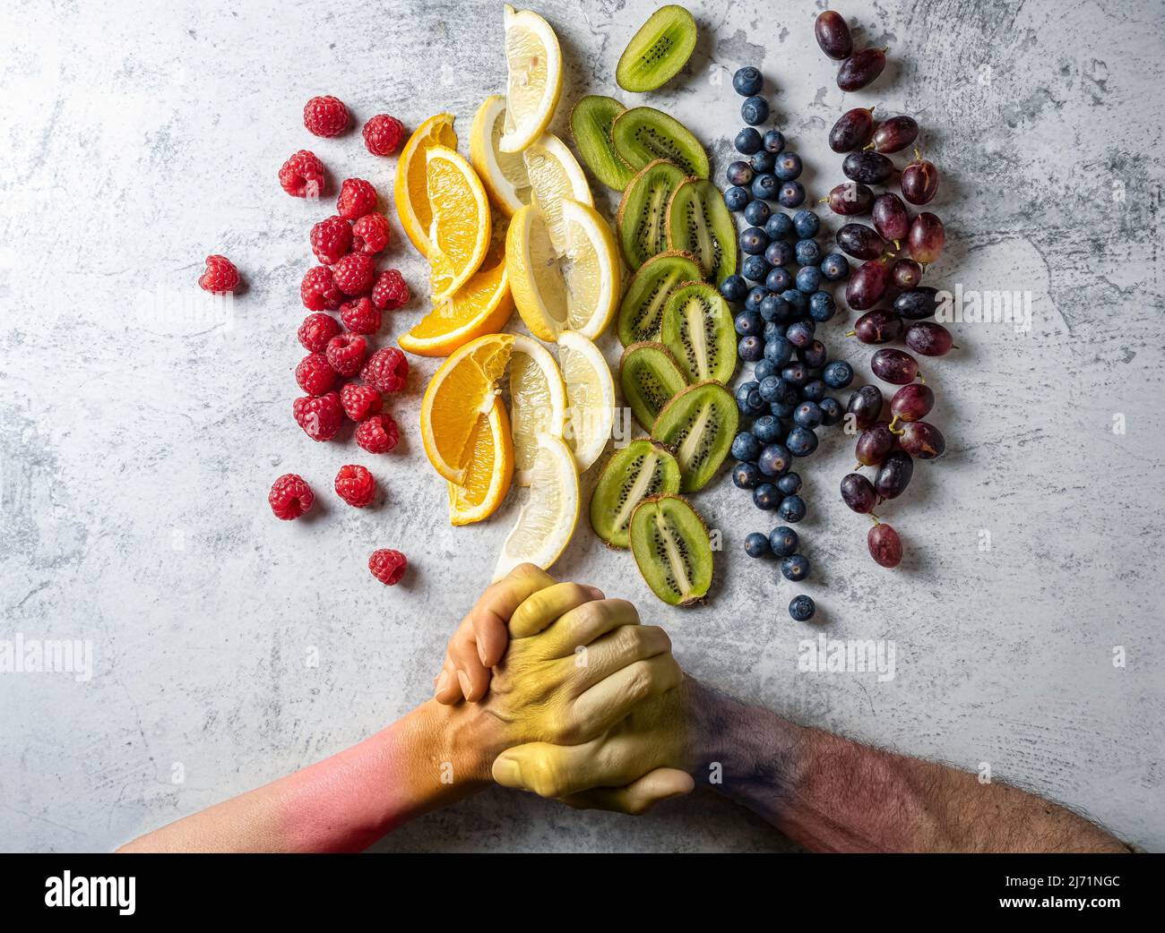 Fruit cut and arranged in the order of the colors of the rainbow. Two ...