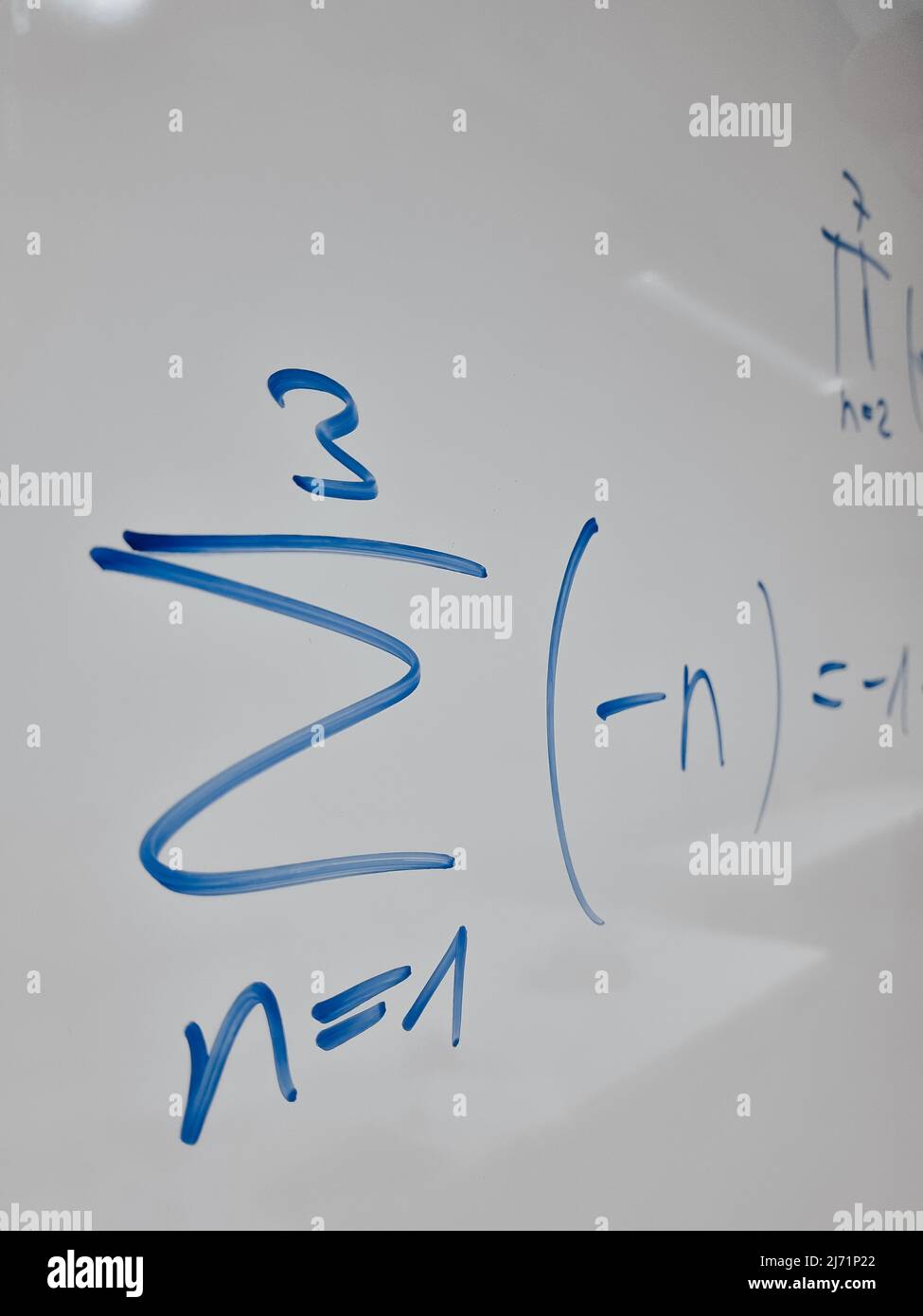 mathematical symbols of an equation from a mathematics lecture on a ...