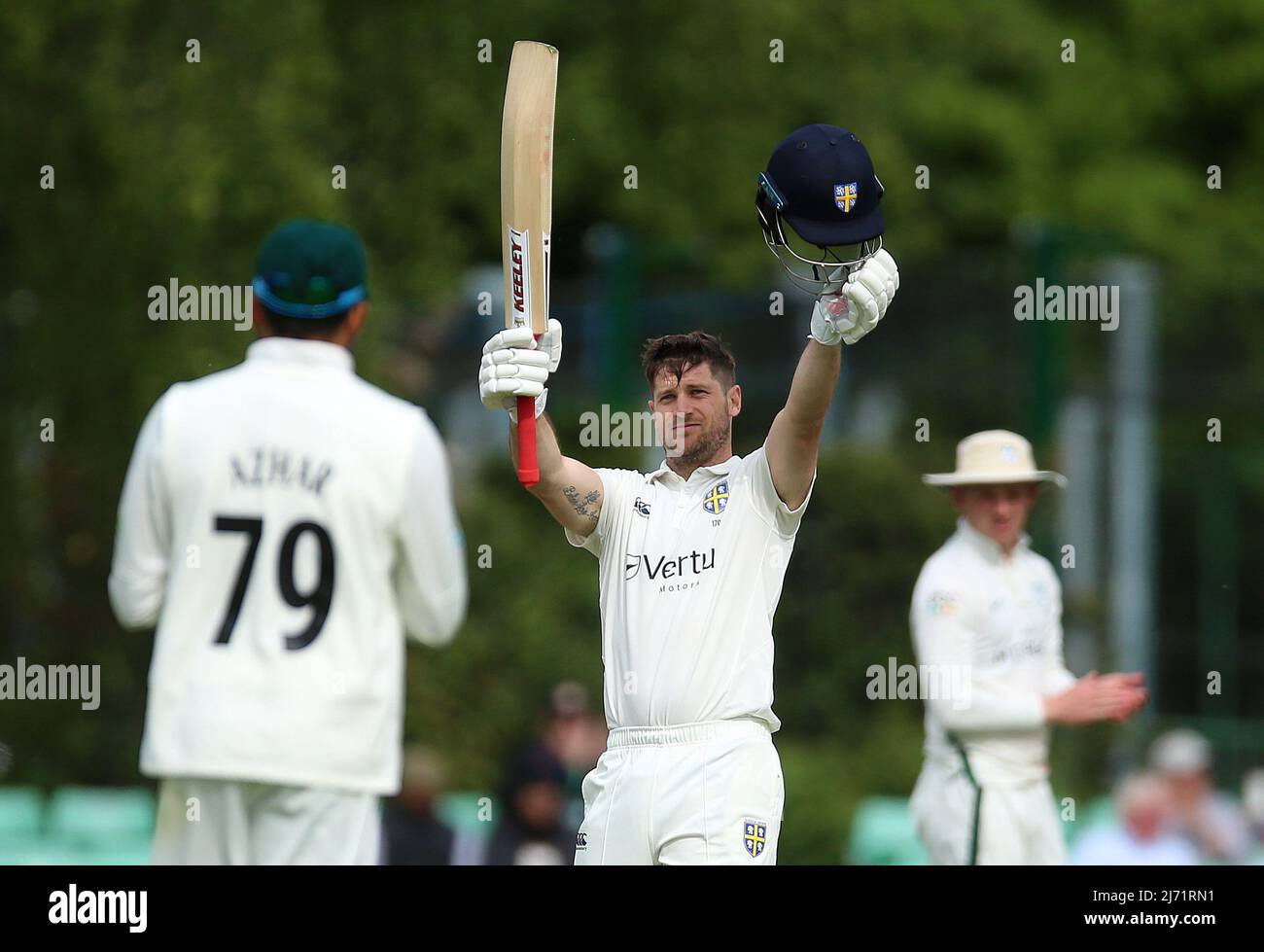 Durham's Sean Dickson celebrates after reaching his century during the ...