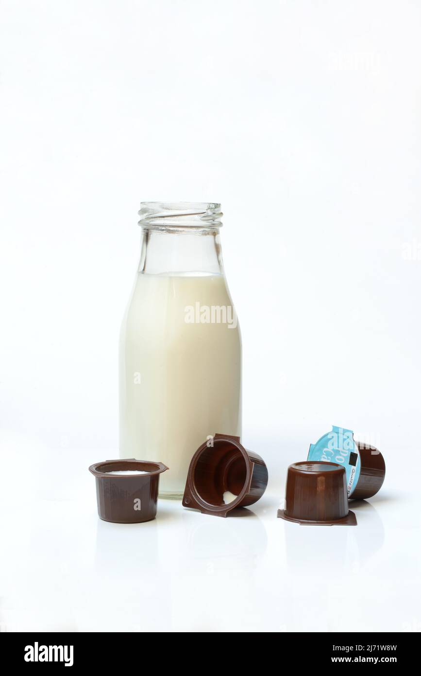 A bottle of milk and milk in portion pack, white background Stock Photo ...