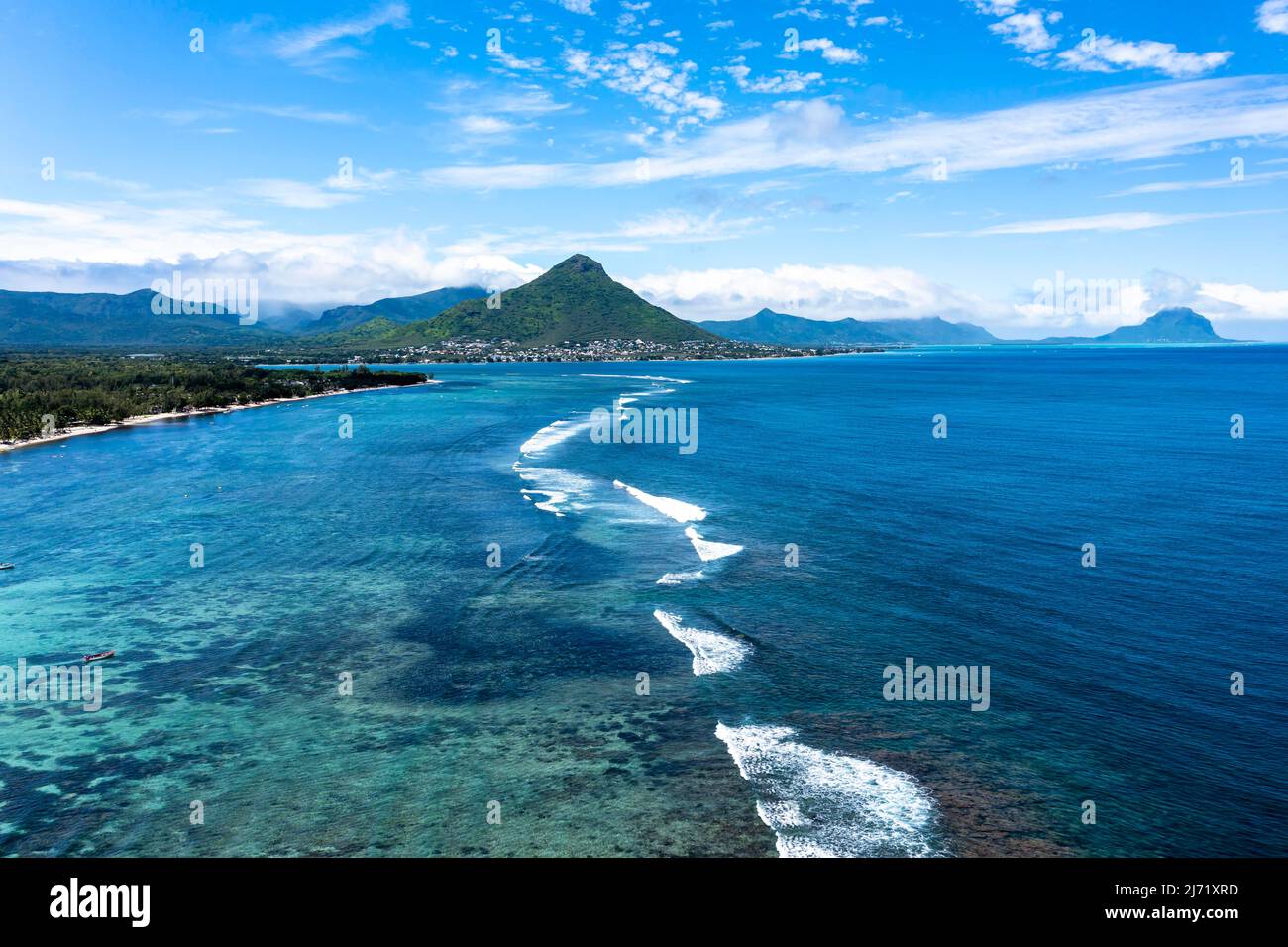 Aerial view of Flic en Flac beach with waves on the reefs, Mauritius ...