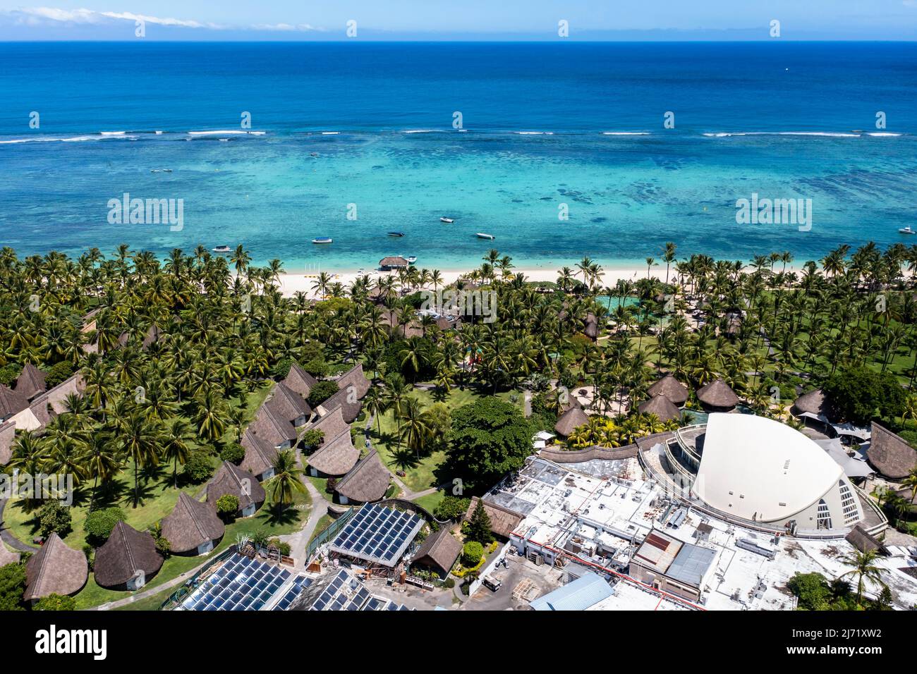 Aerial view The beach of Flic en Flac with luxury hotel and palm trees ...