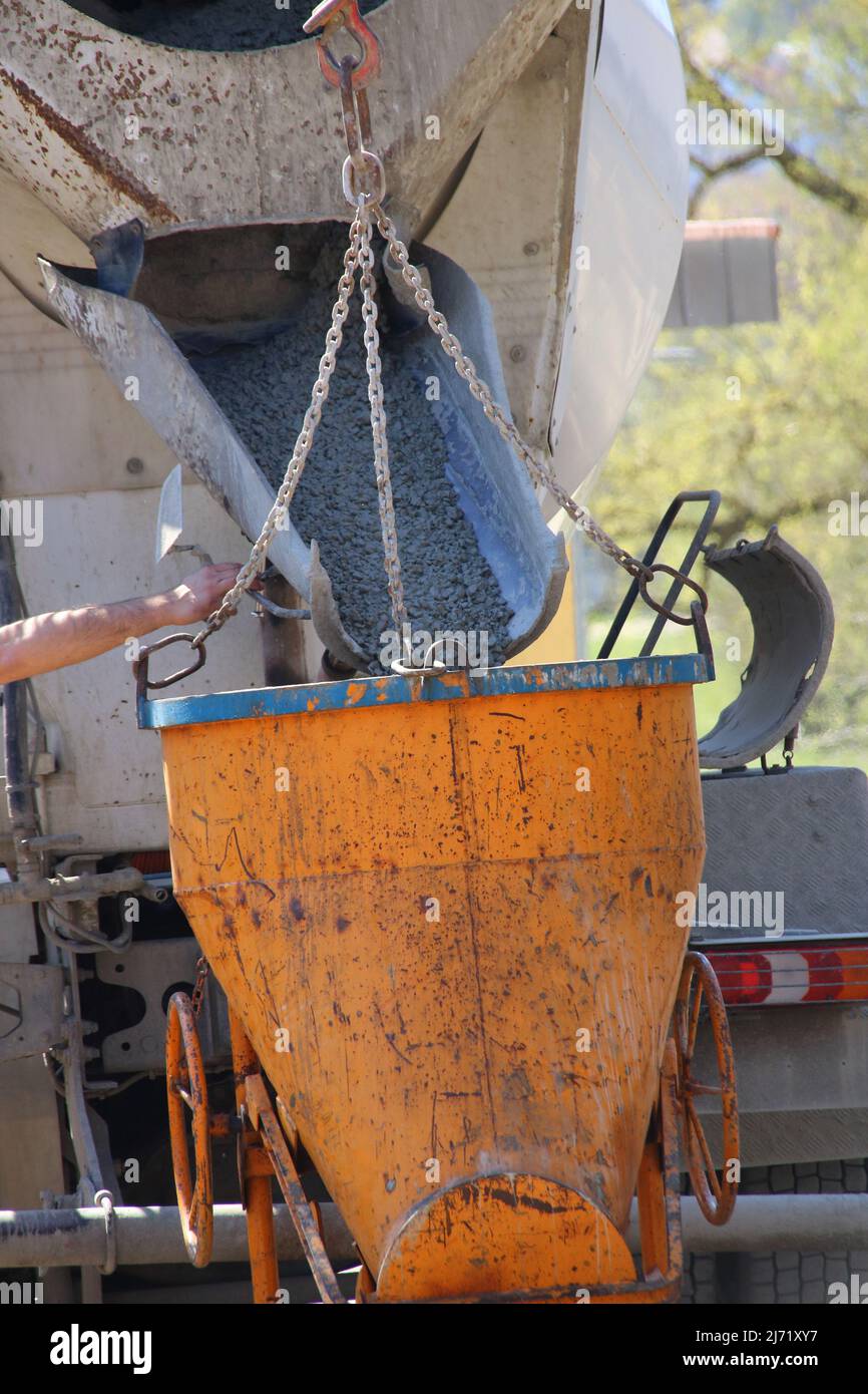 Filling up a foundation with concrete through a silo Stock Photo - Alamy