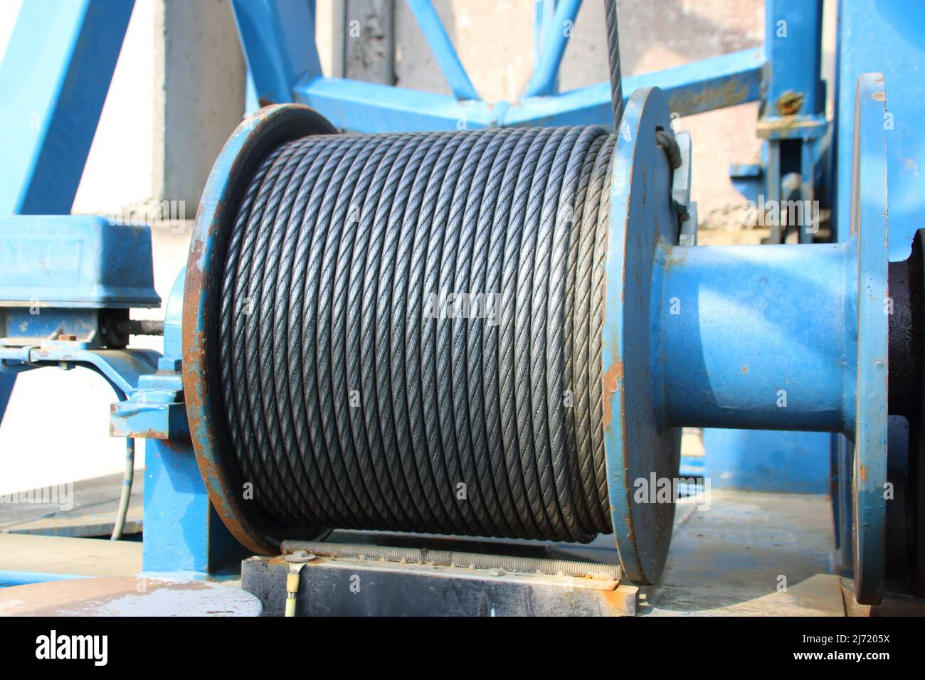 Winch with a wire rope on a crane Stock Photo - Alamy