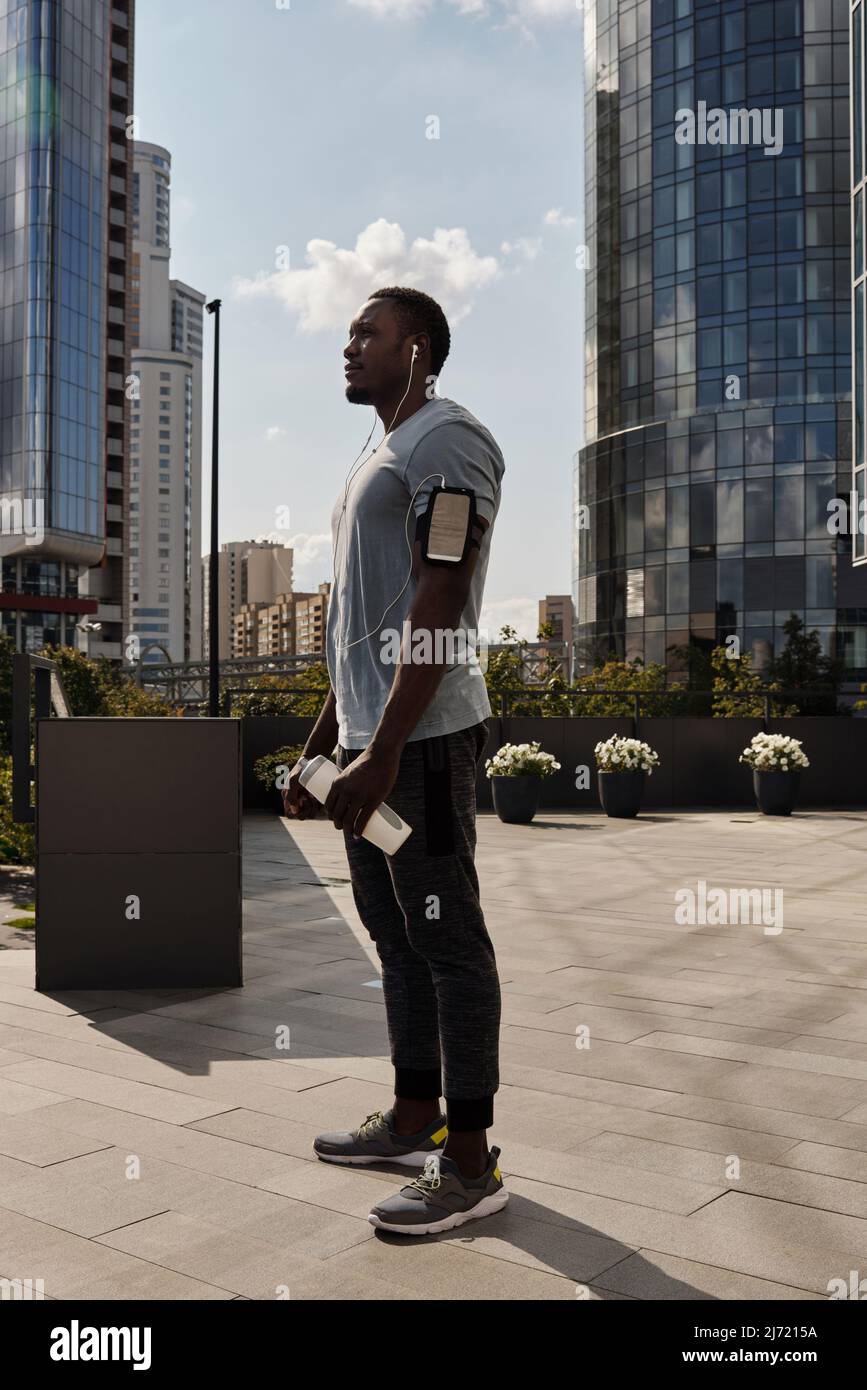 Thoughtful black man standing outdoors hi-res stock photography and ...