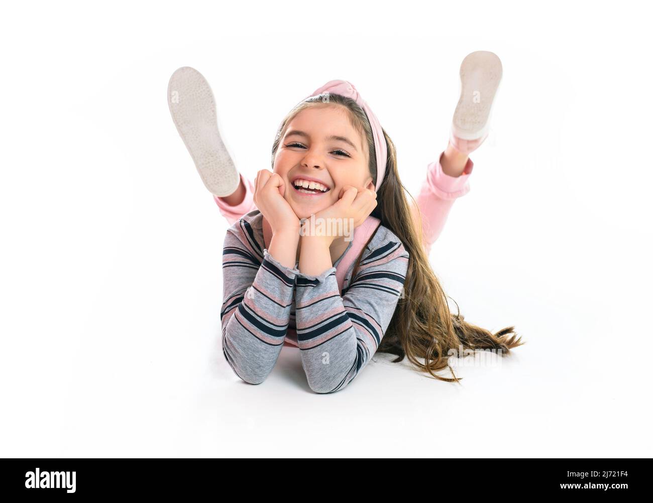 cute child lay over white background on studio Stock Photo - Alamy
