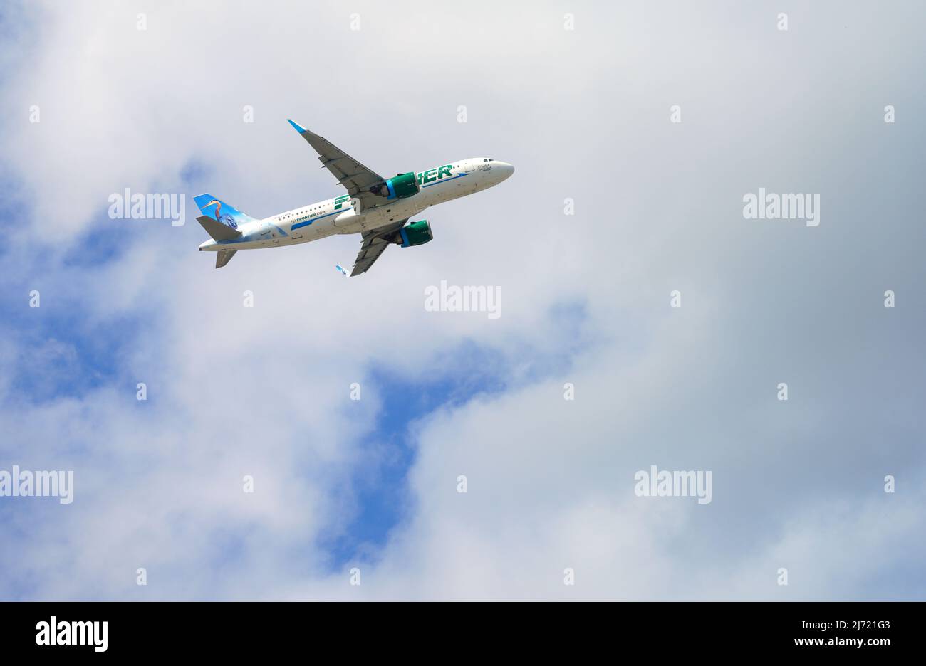 MIAMI, FL -13 MAR 2022- View of an airplane in flight from lowcost ...