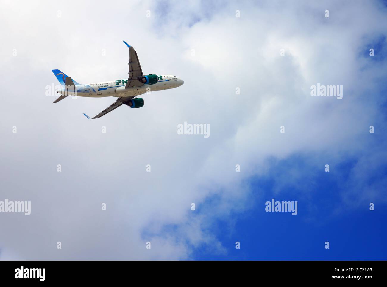 MIAMI, FL -13 MAR 2022- View of an airplane in flight from lowcost ...