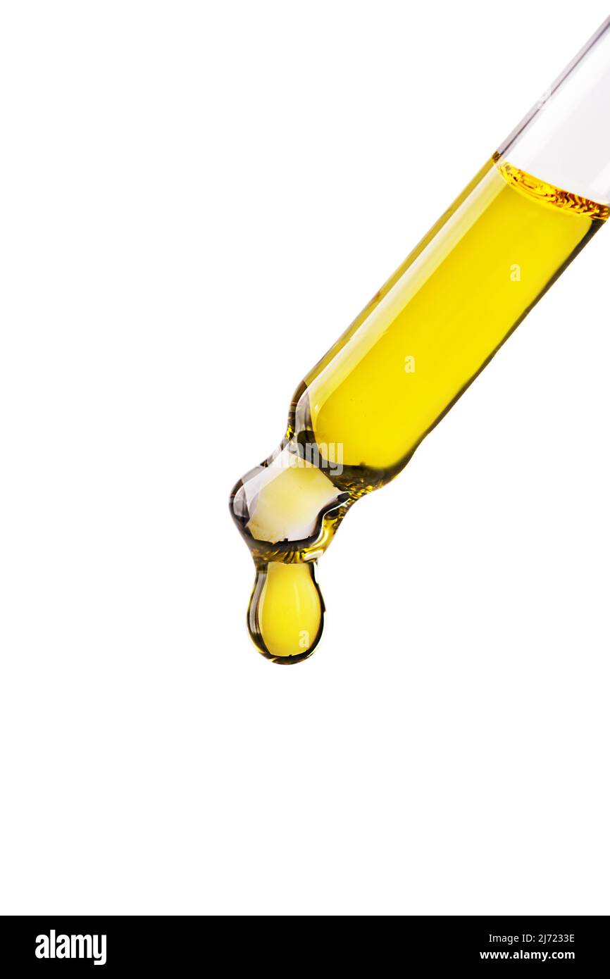 Dropper with cosmetic oil drop isolated on white background. Abstract ...