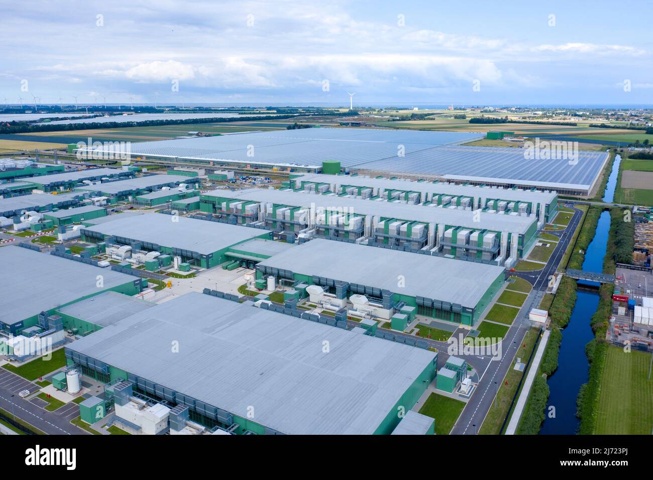 Drone aerial view of new Microsoft datacenters . The huge buildings are located along highway A7 ...