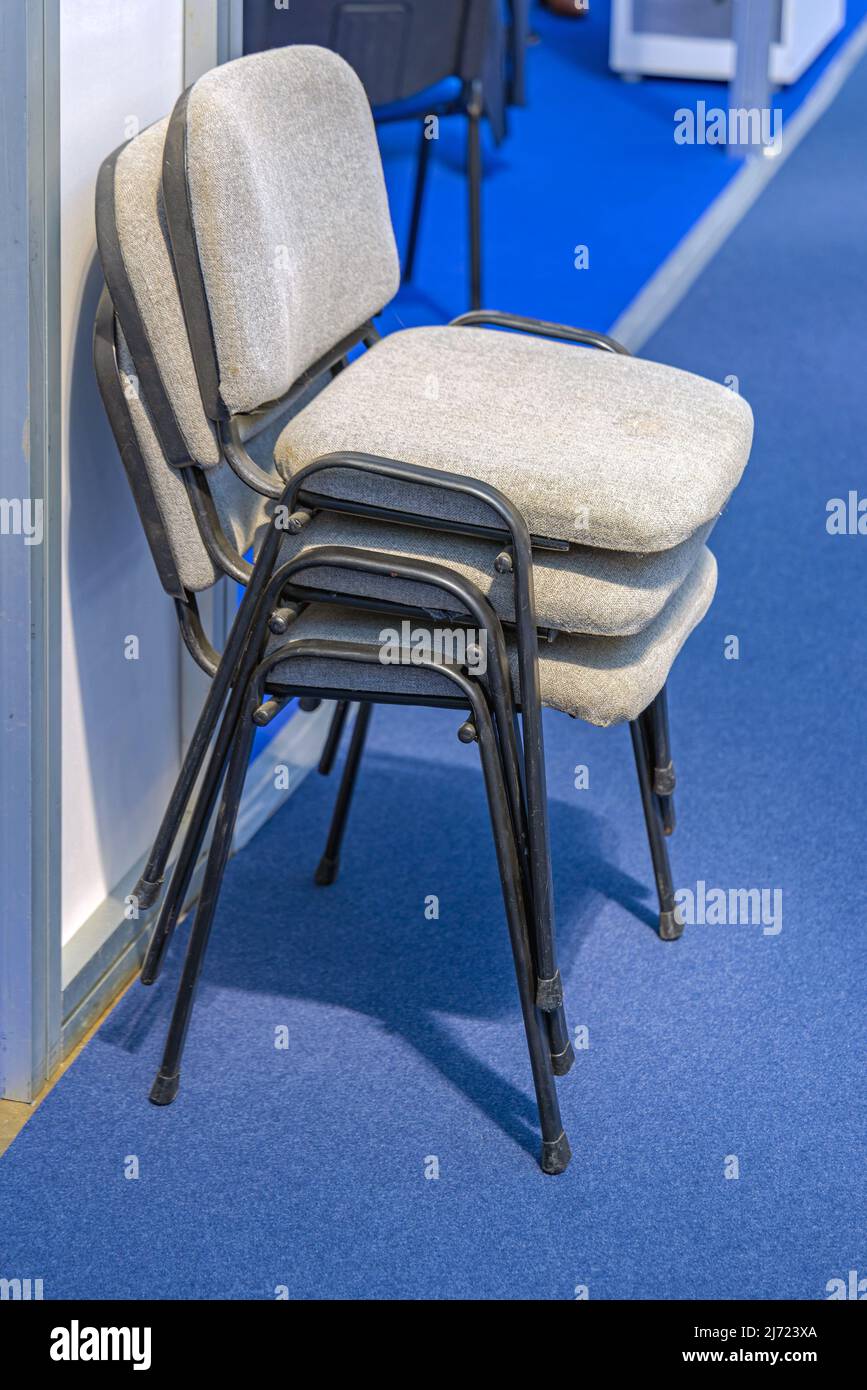 Stack of Four Office Chairs in Conference Room Stock Photo - Alamy
