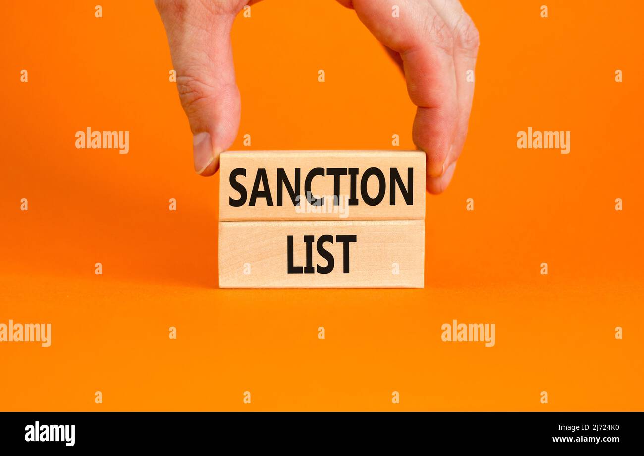 Sanction list symbol. Wooden blocks with concept words Sanction list on ...