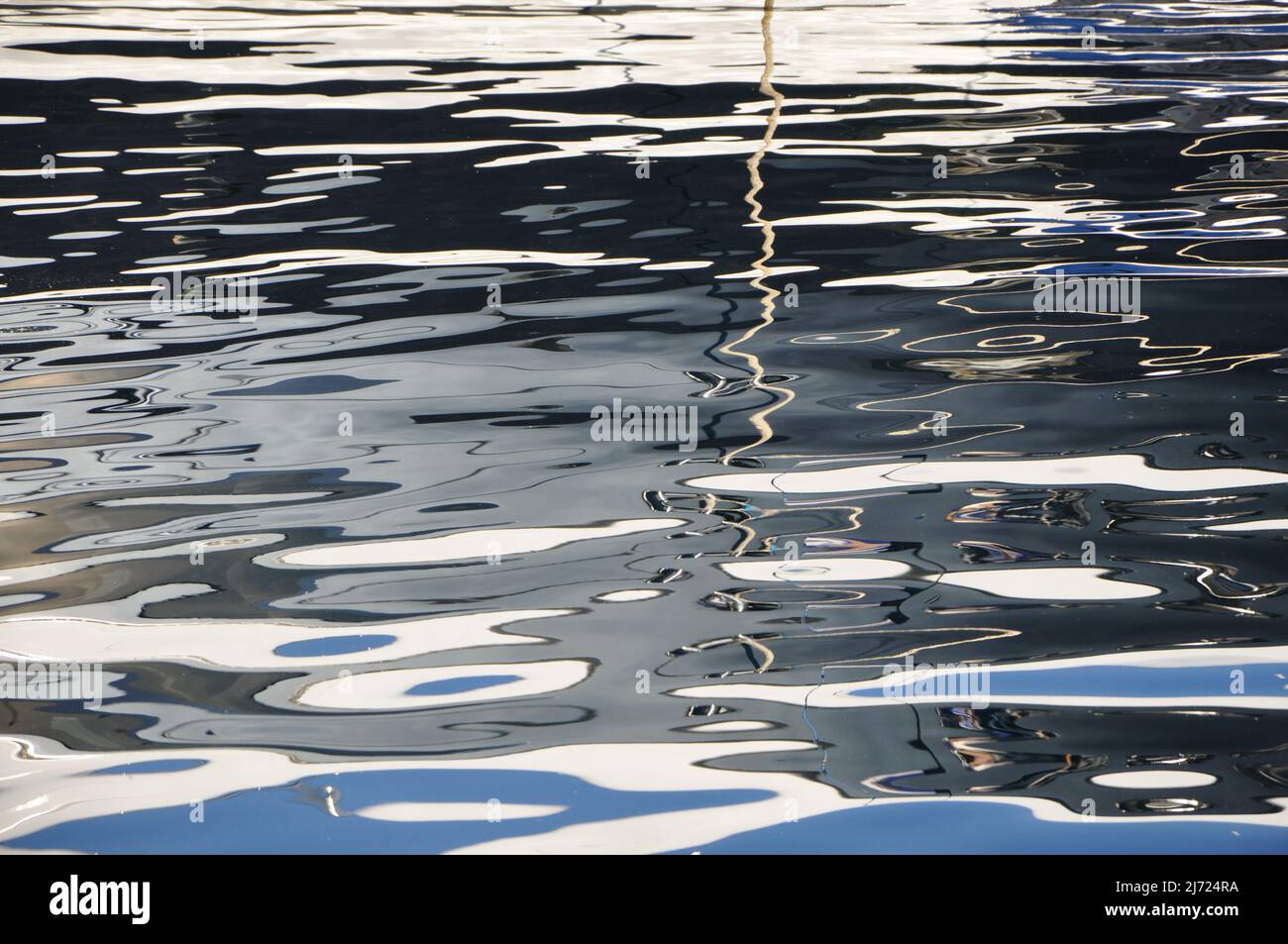 Abstract reflection of colorful Rijeka building on sea. Sea surface ...