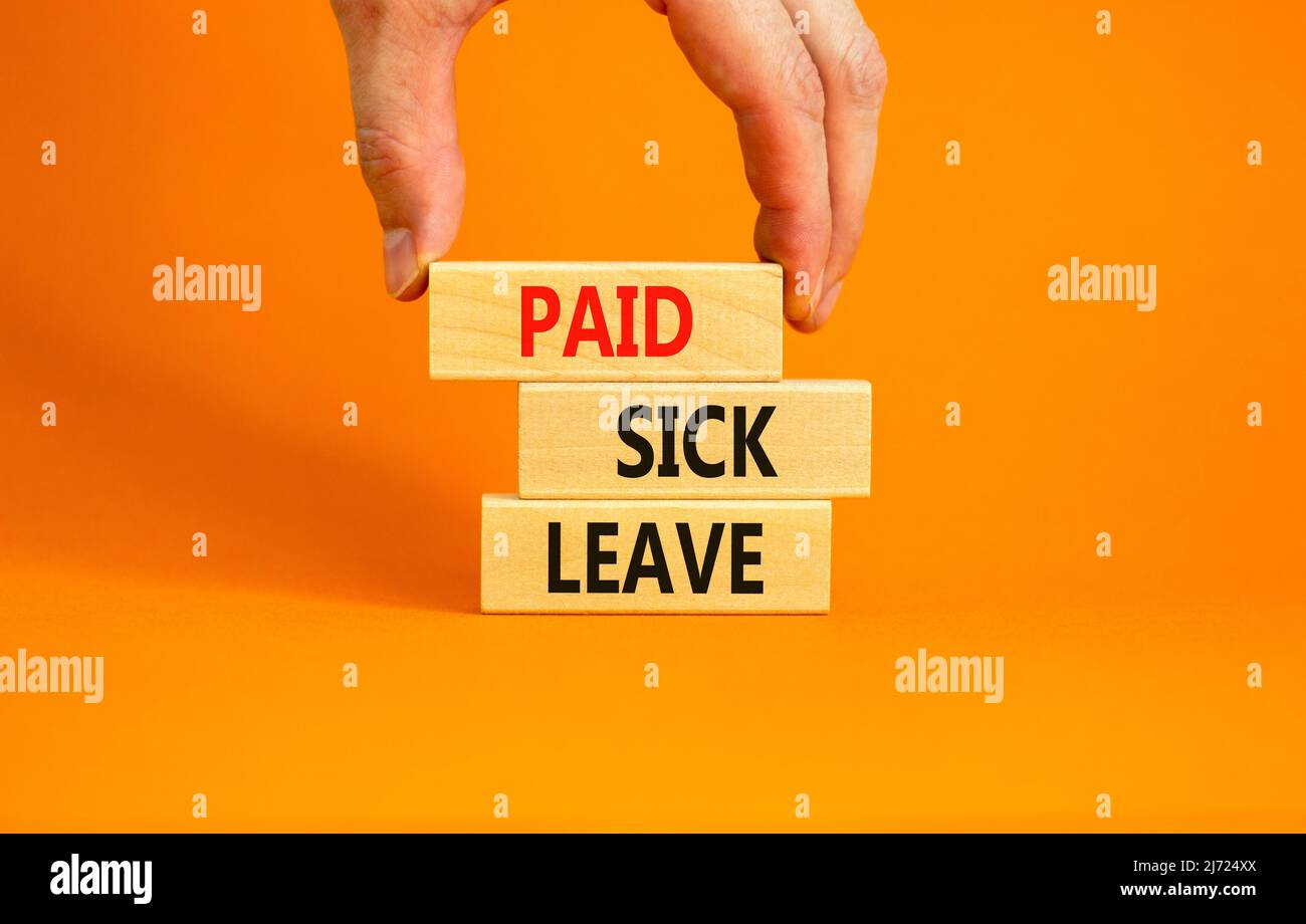 Paid sick leave symbol. Concept words Paid sick leave on wooden blocks ...