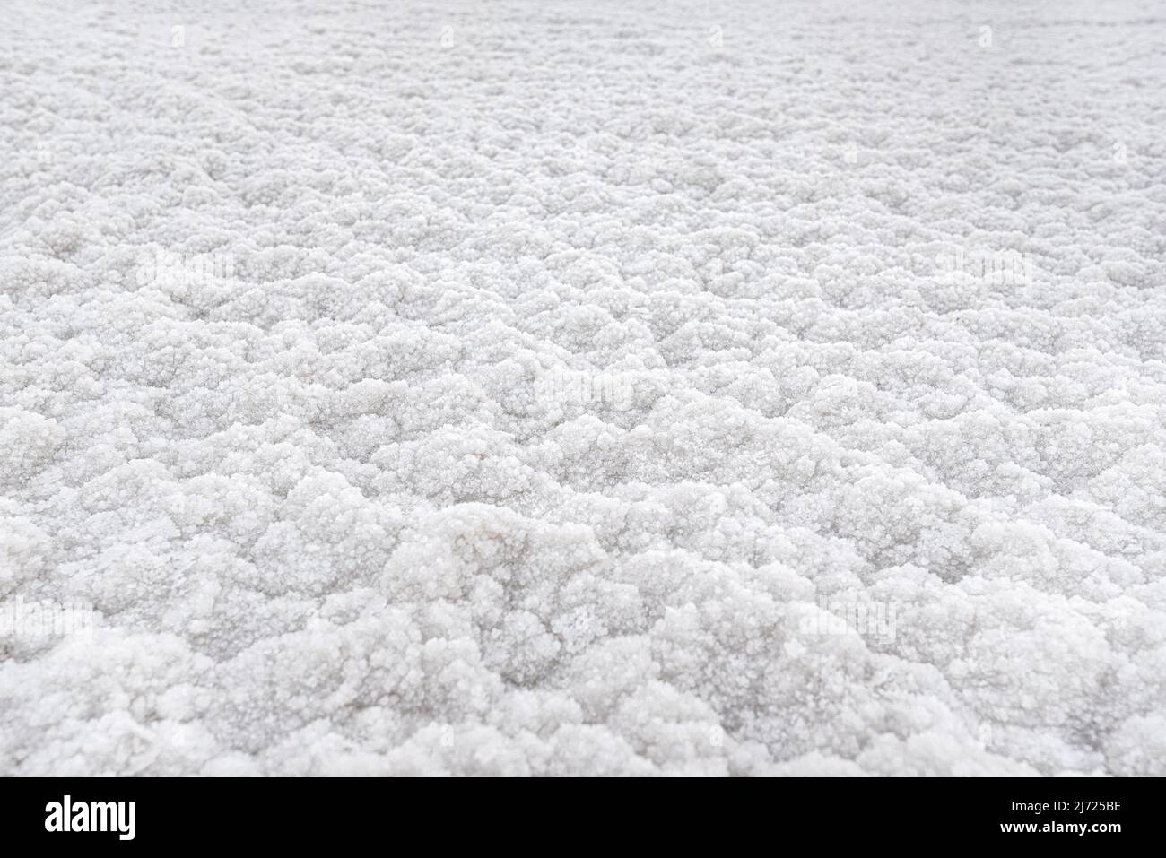 White crystalline salt closeup detail on Ein Bokek beach at Dead Sea - world most hypersaline ...