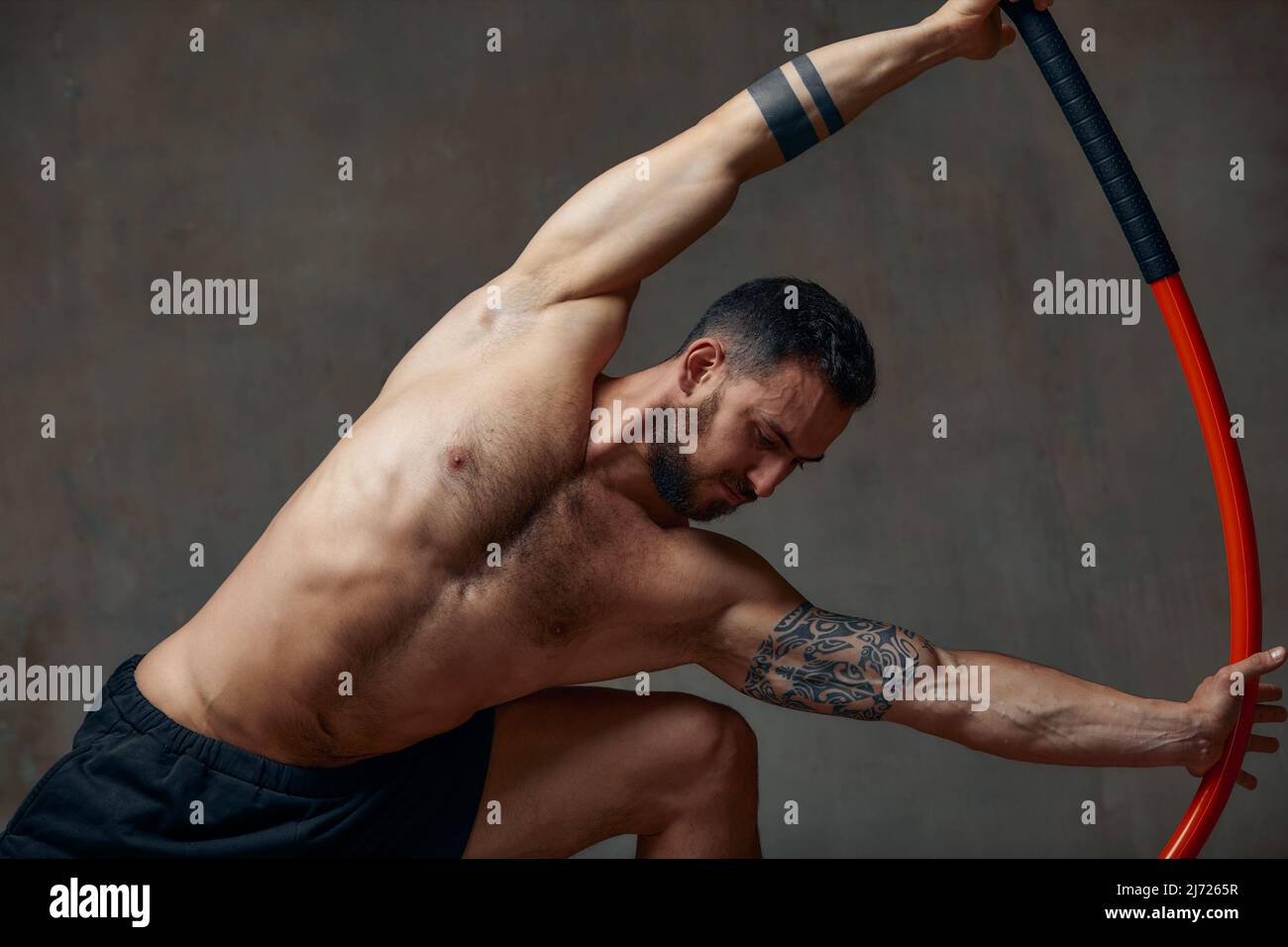 athlete men with stick training karate using sports tool in studio on ...
