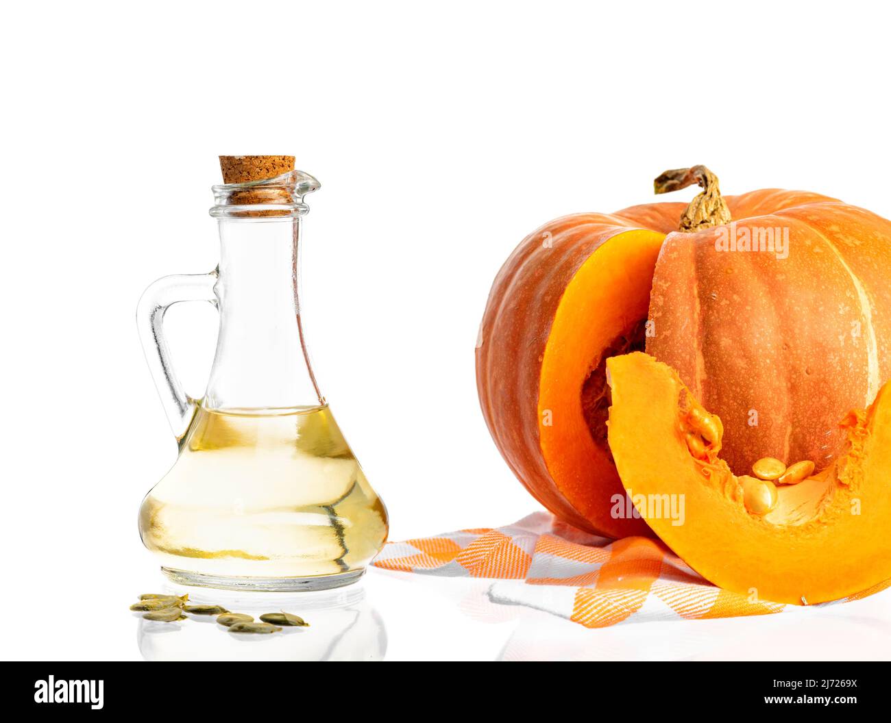 pumpkin oil close up isolated on white Stock Photo - Alamy