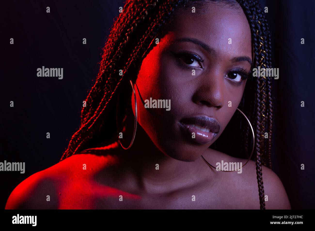 African American woman with Red and Blue studio lights Stock Photo - Alamy