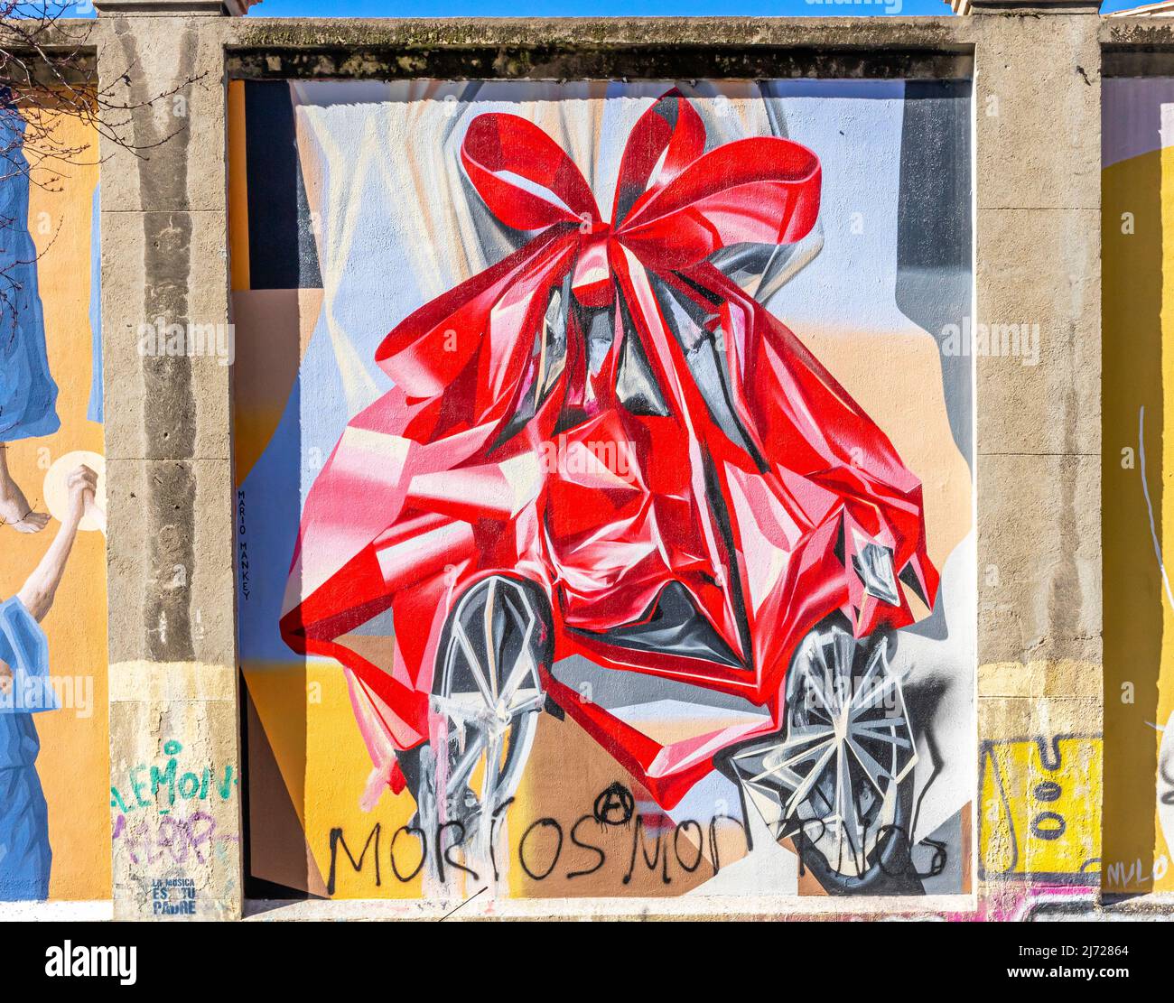 The red crashed car mural wall in Lavapiez, Madrid featuring mural work ...