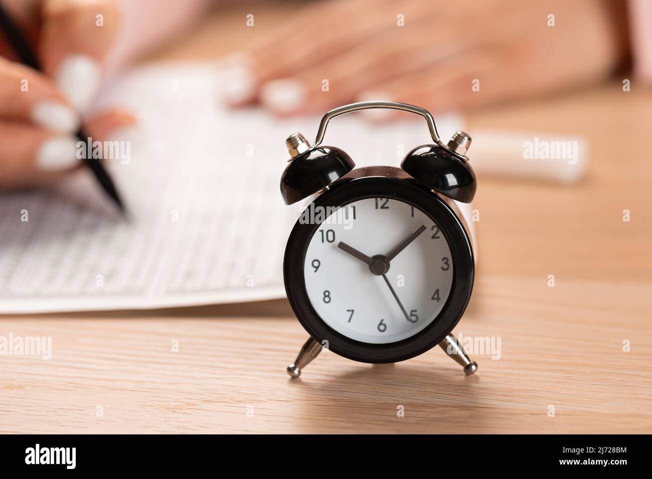 alarm clock for a student writing exams, taking an exam room with a ...
