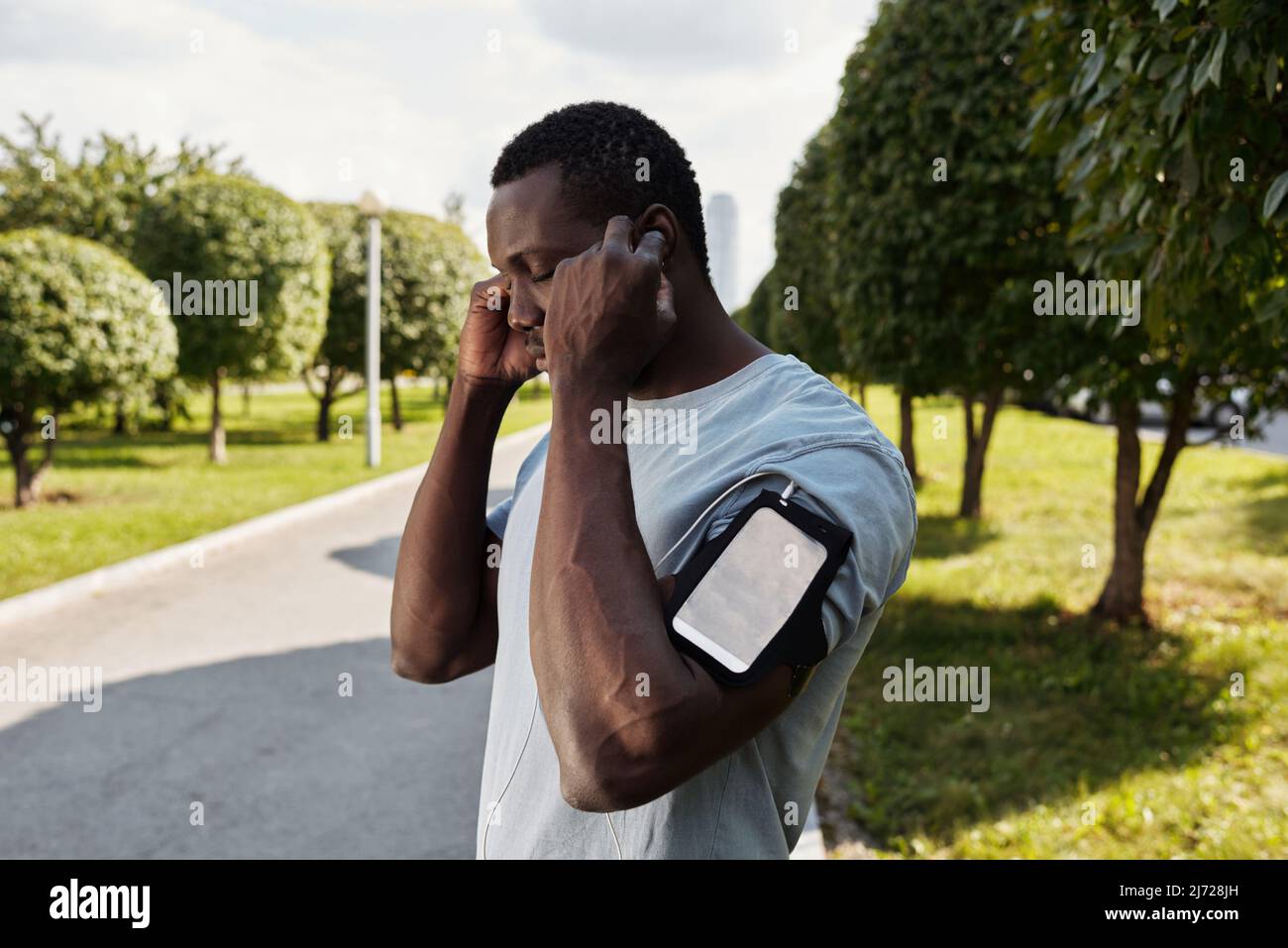 Athlete getting ready for workout. Portrait of young muscular Black man ...