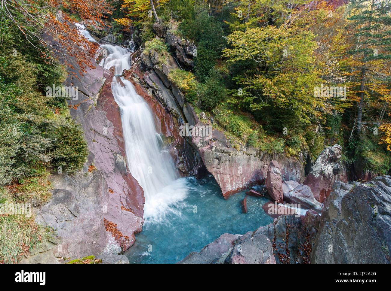 Waterfall at La Larri river in autumn, Pineta valley, Pyrenees, Spain ...