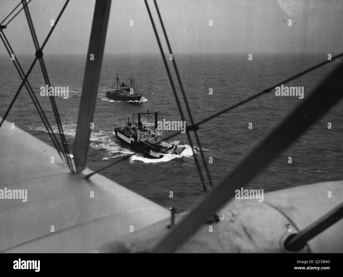 An aerial view of naval salvage vessels patrolling the area where the ...