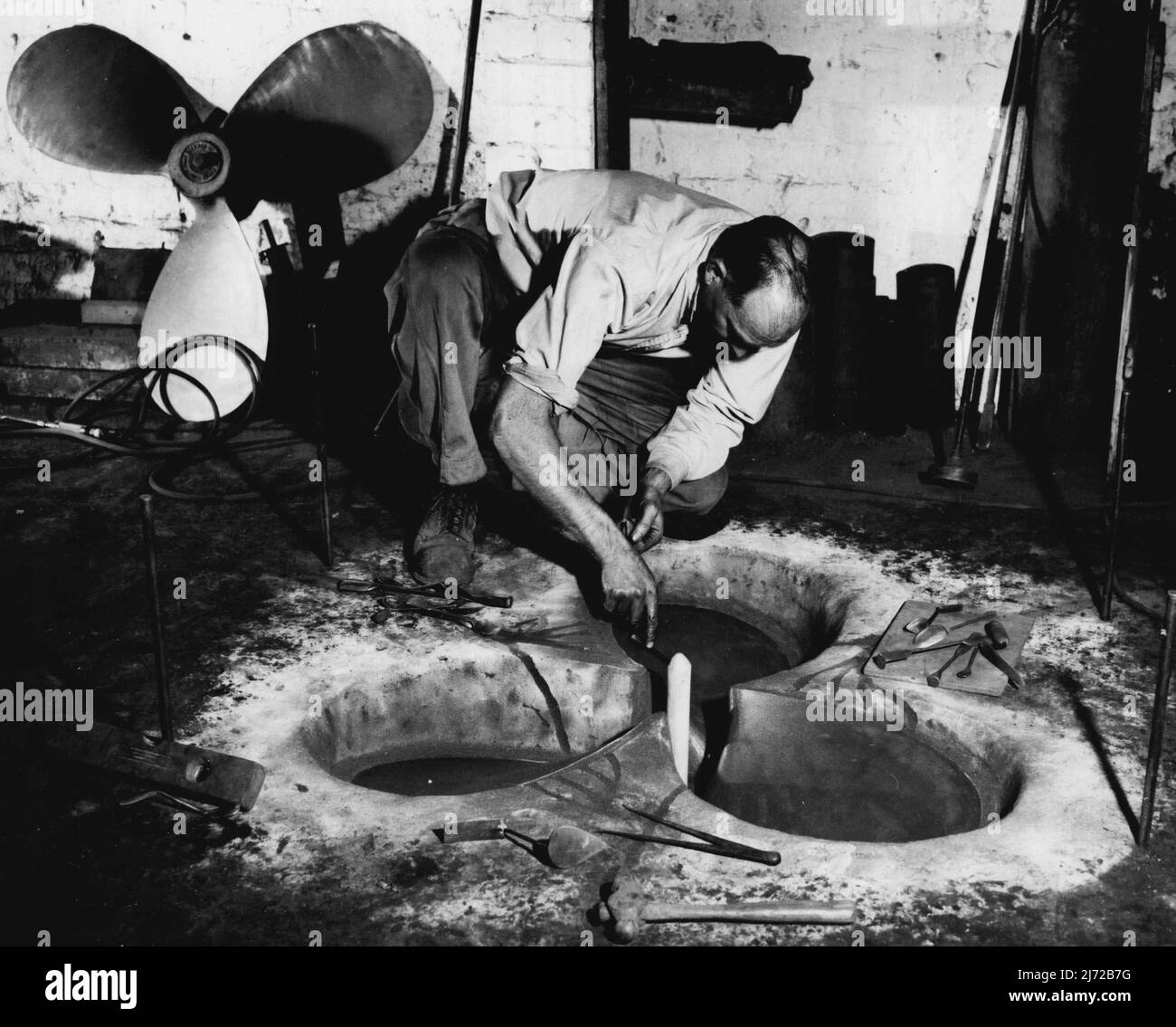 Moulder Jack Neall delicately puts finishing touches to the lower half ...