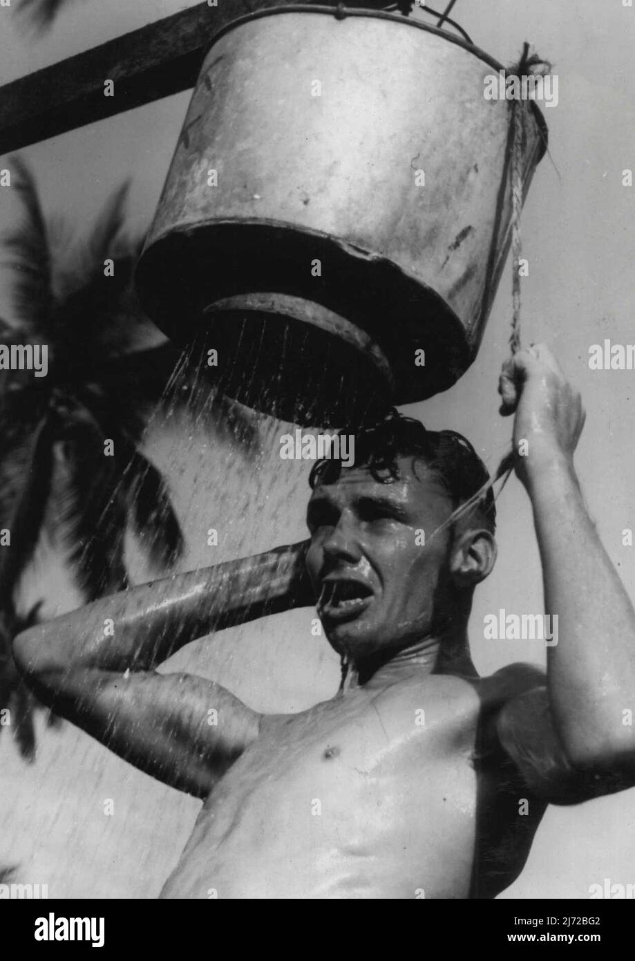 Open air shower in Aust. Army camp in D.N.G. Sgt. H.B. Kirkpatrick (N.S ...
