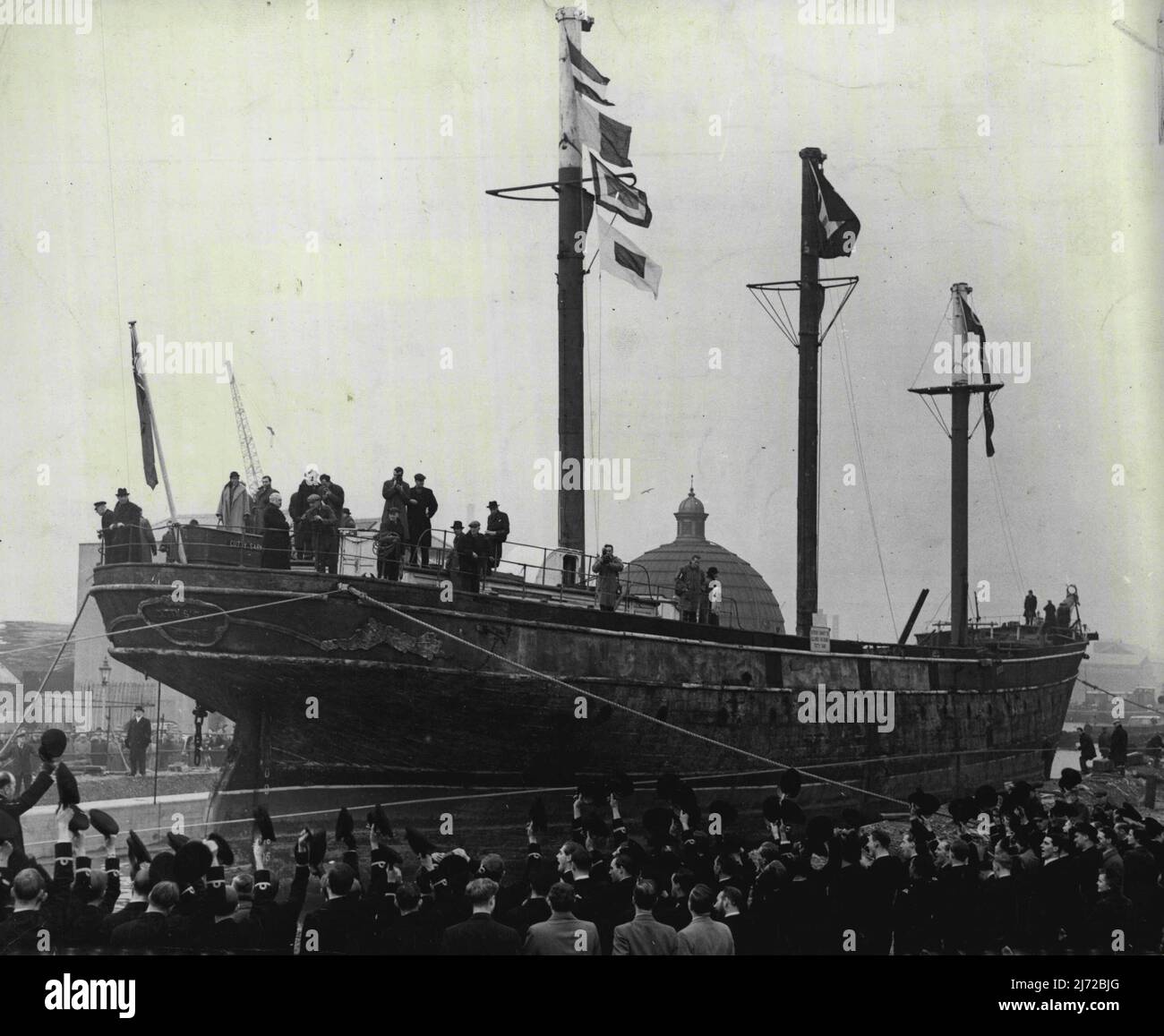 Cadets of the Royal Naval College give three cheers as the "Cutty Sark ...