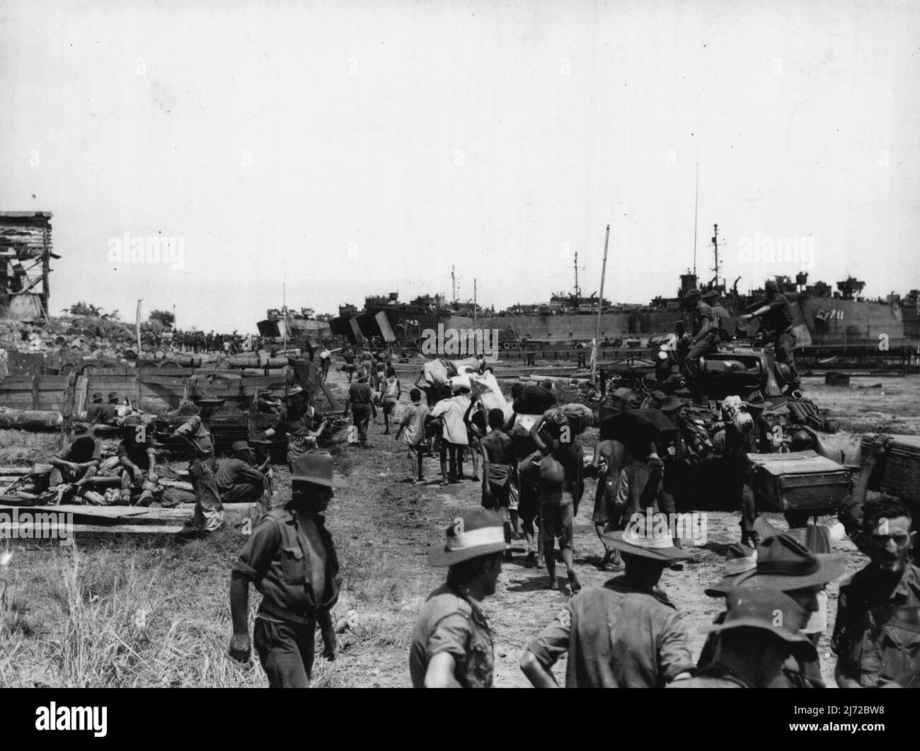 Liberated civilians getting away from battle and Australian going into ...