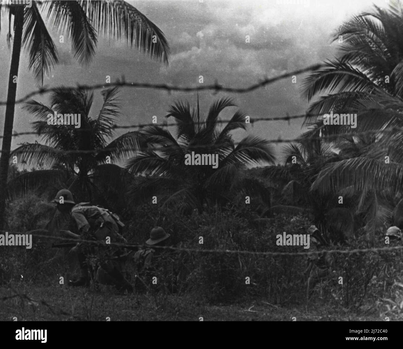 Portion of Singapore's barbed wire beach defenses. July 28, 1941 Stock ...