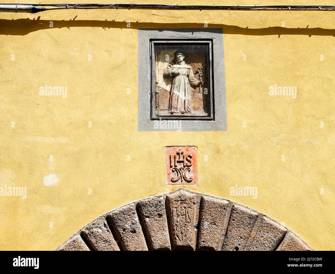 Religious, Christian symbols over doorway entrance to residential ...