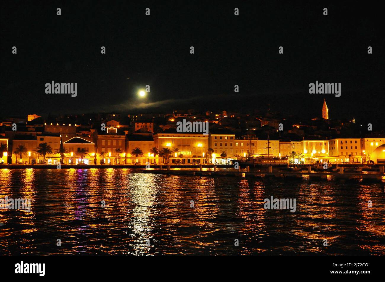 City of Mali Losinj in night scene taken by the sea so light reflect to ...